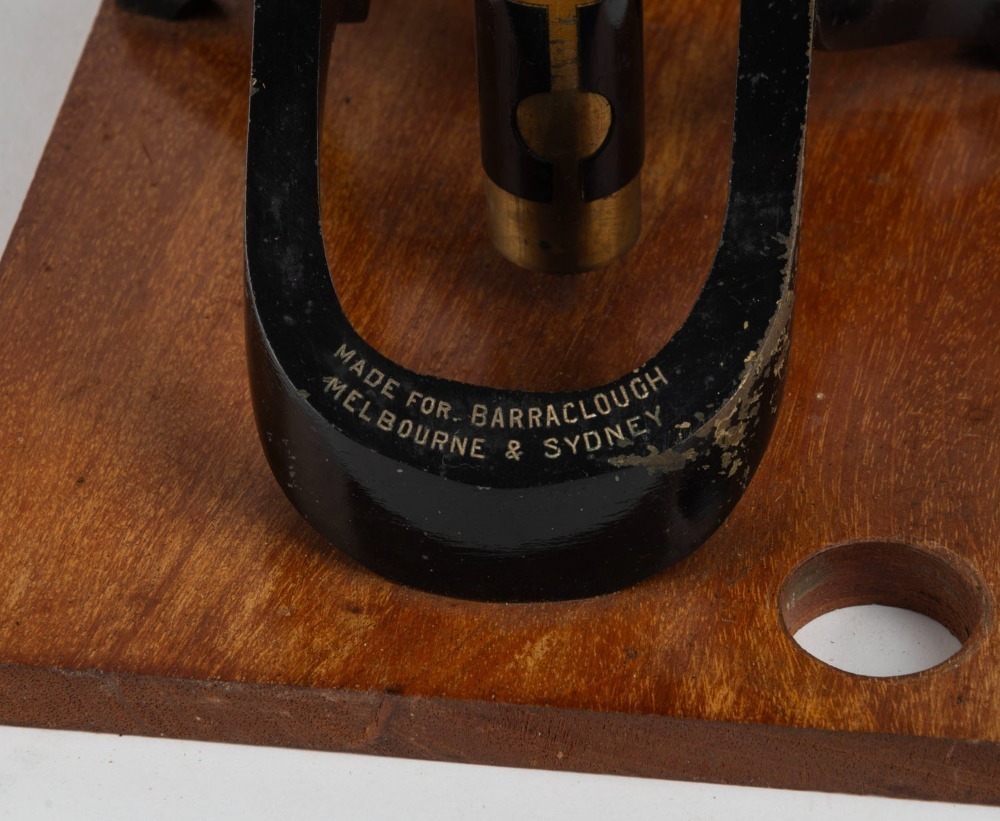 Brass and steel microscope with base engraved 'Made for Barraclough ...