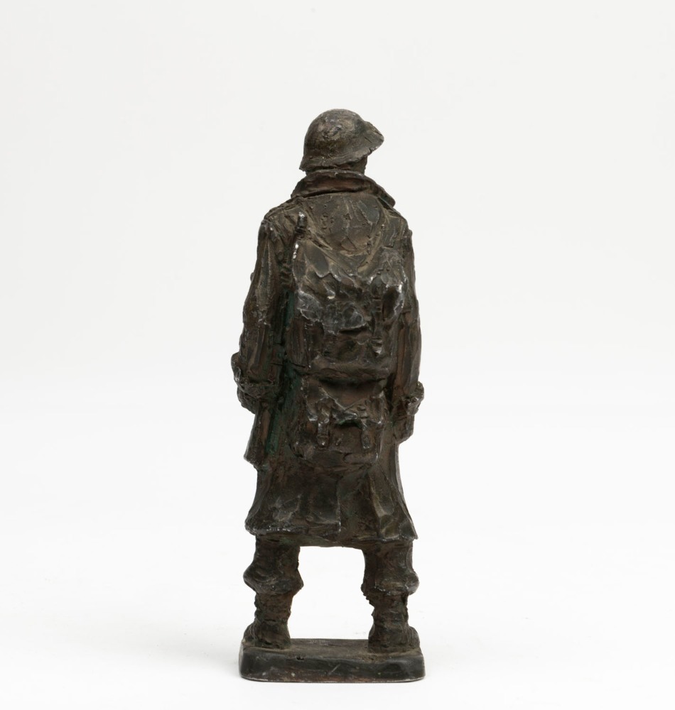 A WW1 period cast metal statue of a soldier, 13cm high