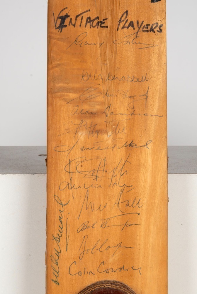 A full-sized Centurion cricket bat with a half Clive Lloyd Red Stripe ...