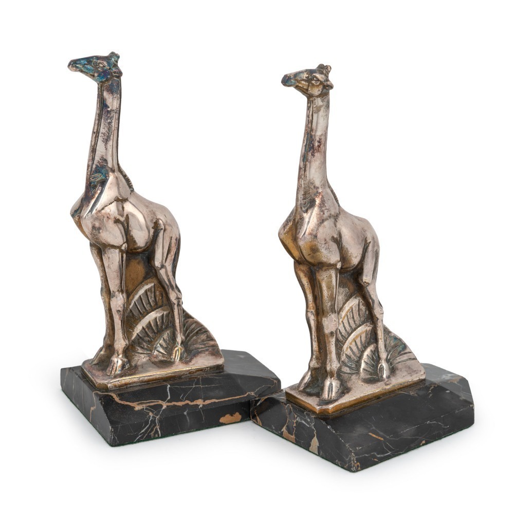 A pair of French Art Deco bronze giraffe bookends with silvered finish ...