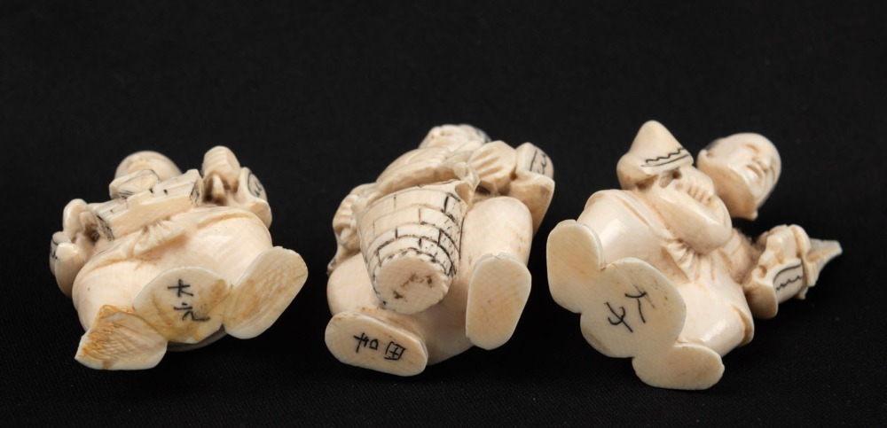 Three vintage Japanese carved ivory figural netsukes, 20th century, the ...