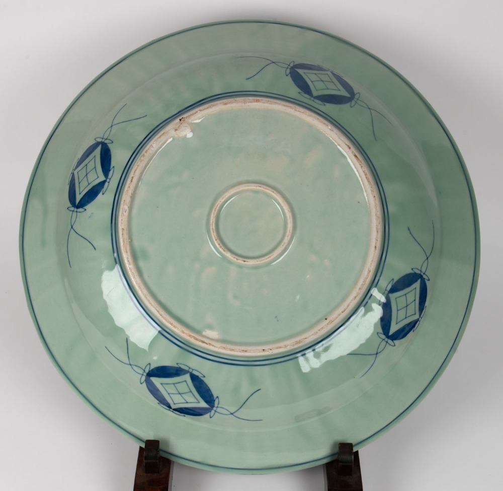 A Japanese celadon and blue porcelain charger depicting a map of old ...