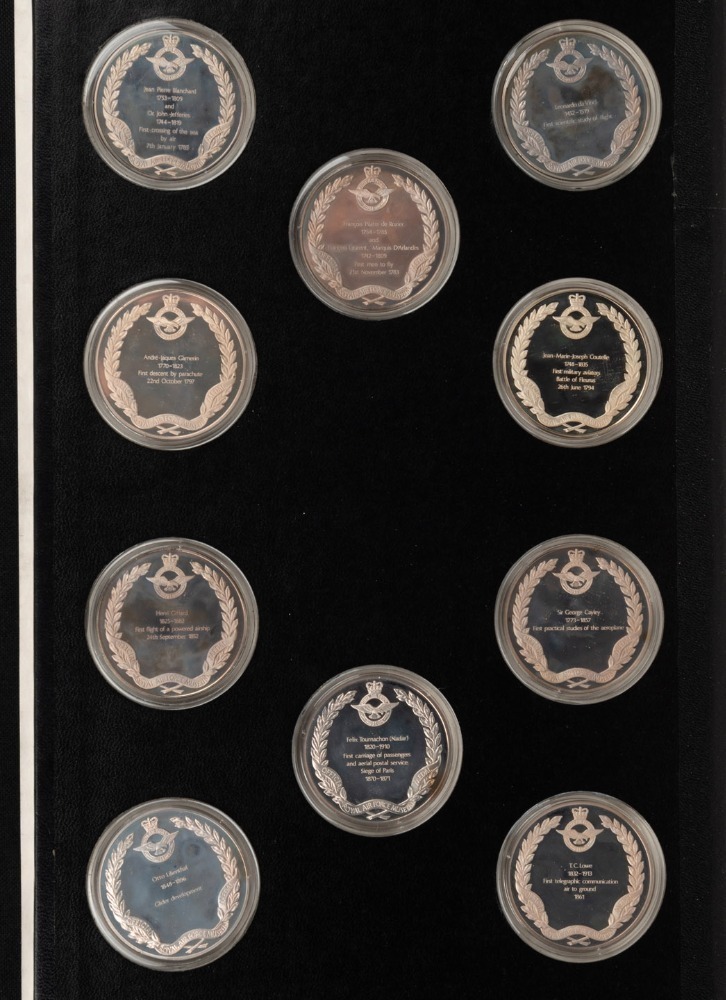 THE HISTORY OF MAN IN FLIGHT: a set of 50 silver medallions, each ...