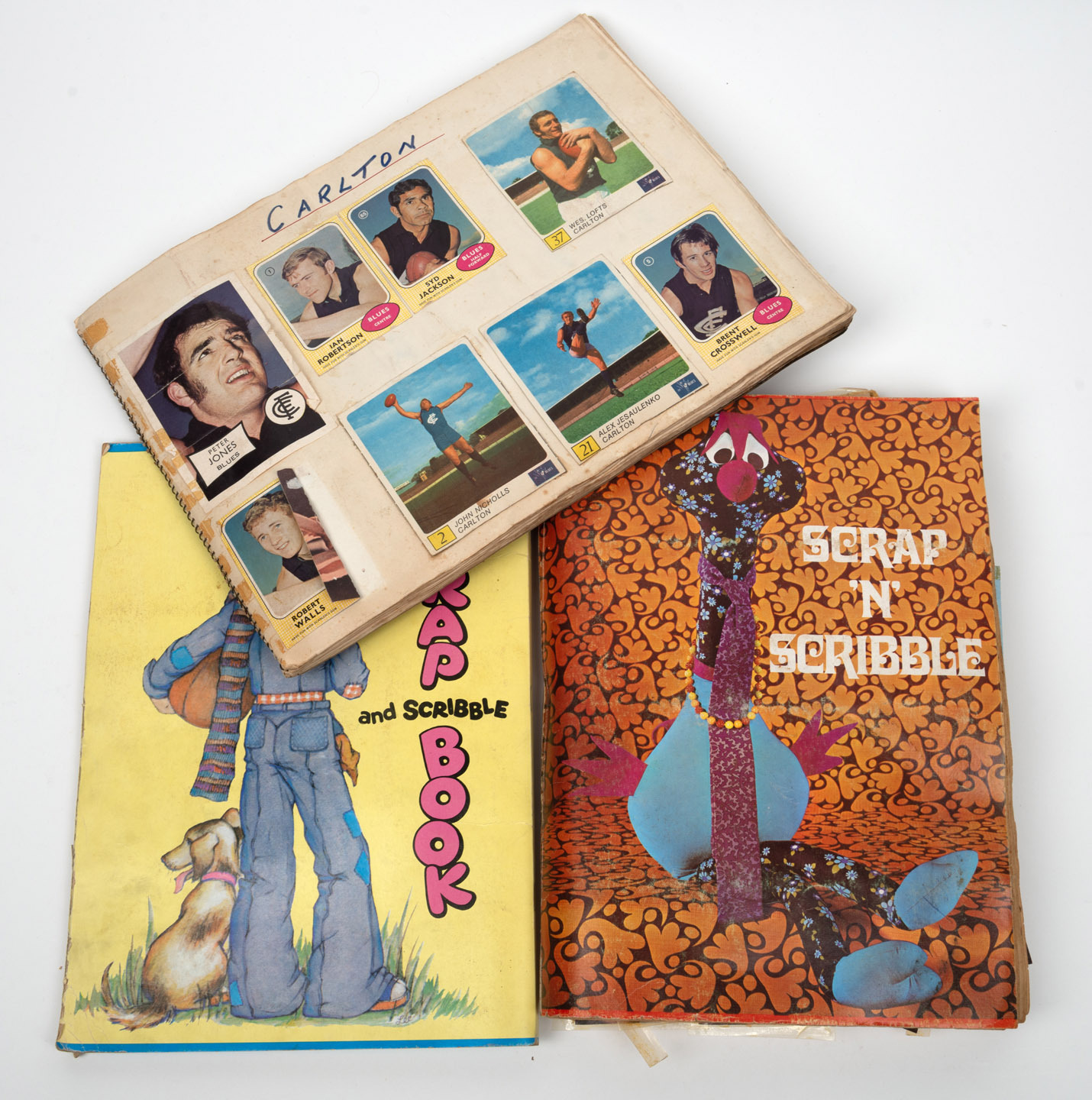 Three scrapbooks filled with mostly 1970s Scanlens football cards.